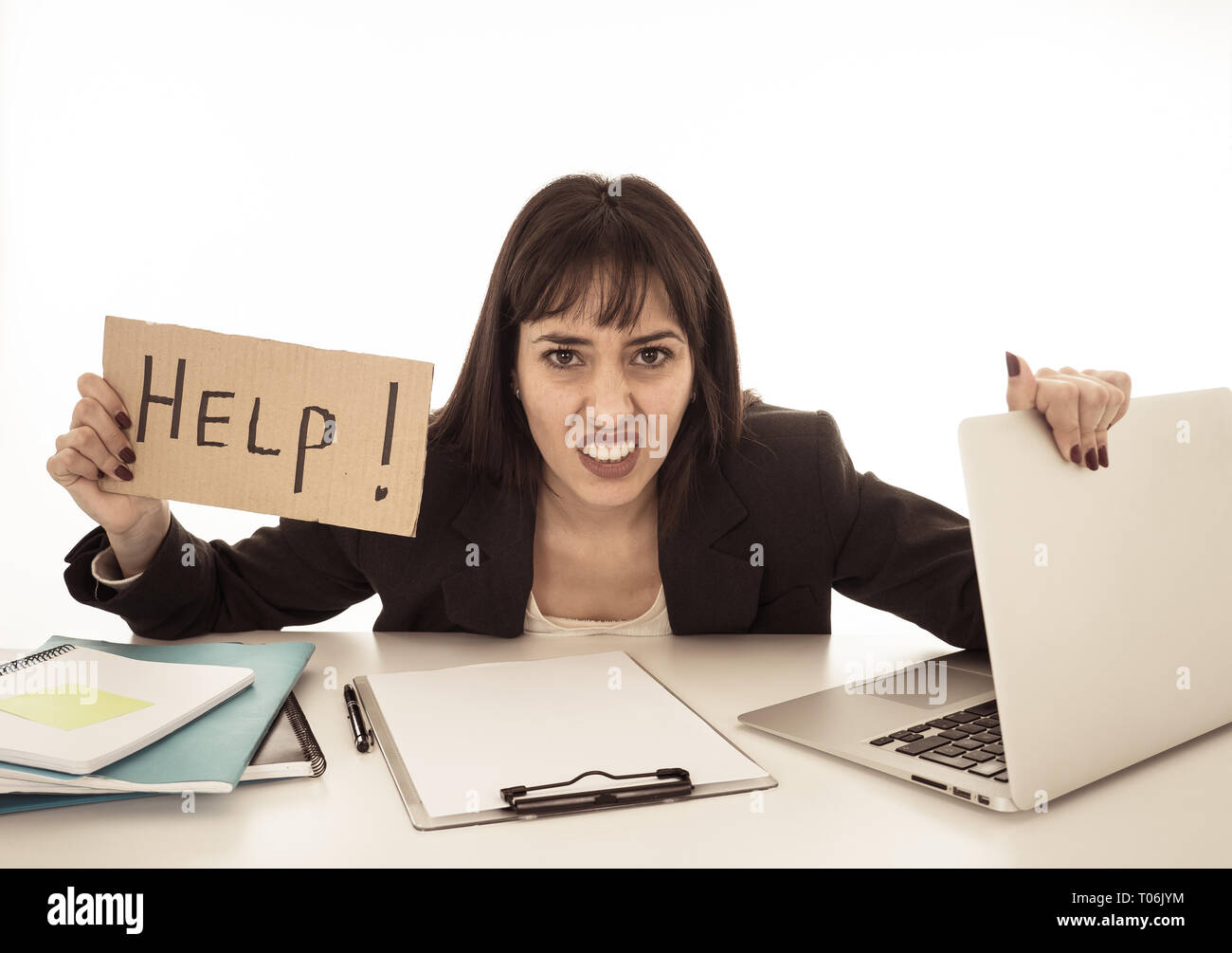 Young beautiful business woman suffering stress working at desk holding ...