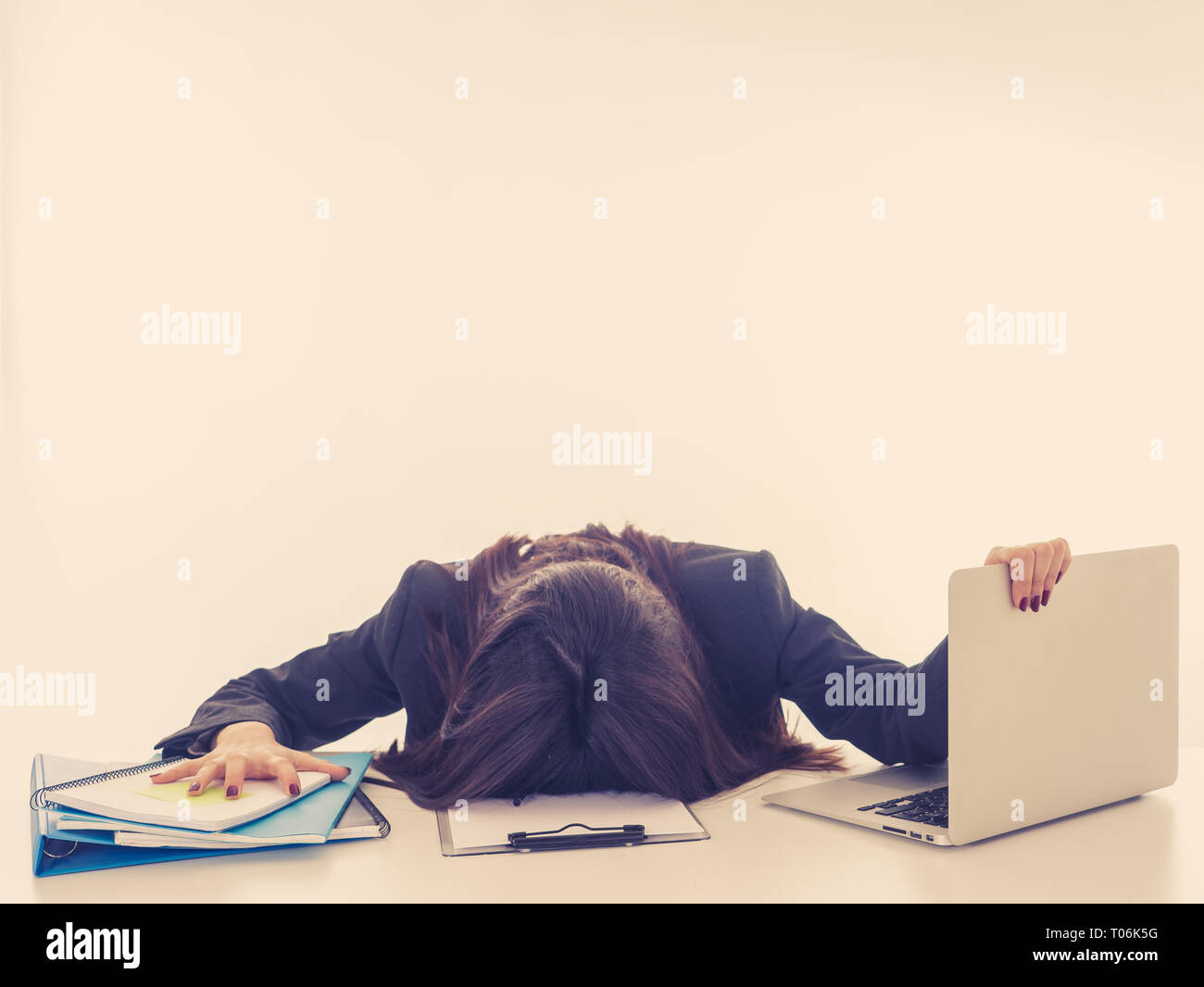 Young beautiful business woman suffering stress working on laptop at ...