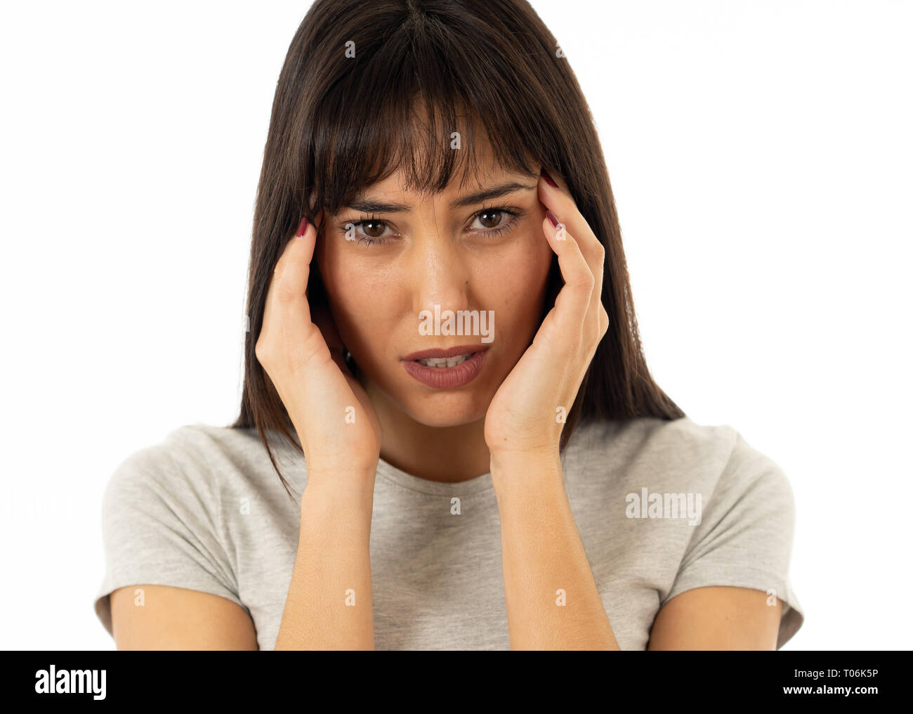 Close up portrait of a young sad woman, serious and concerned, looking ...