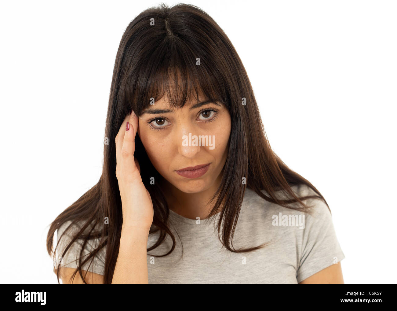 Close up portrait of a young sad woman, serious and concerned, looking ...