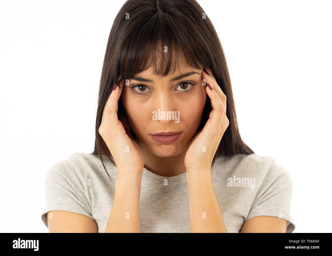 Close up portrait of a young sad woman, serious and concerned, looking ...