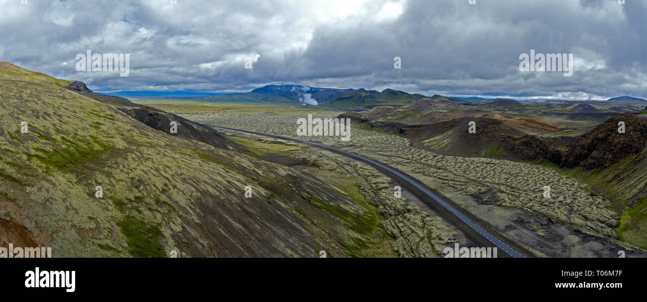 stunning drone shots of an isolated road passes through a volcanic ...