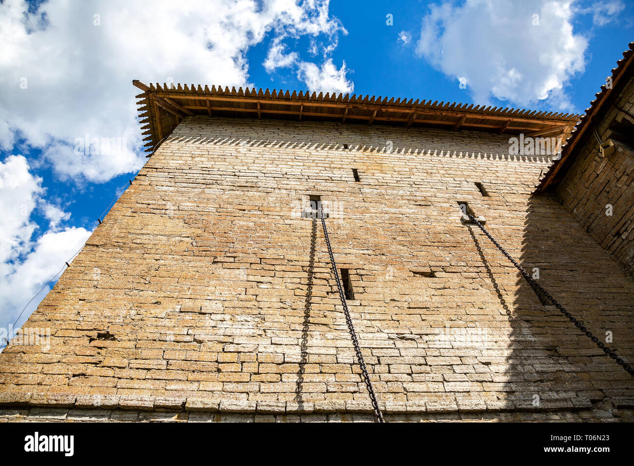 Tower of ancient Oreshek fortress with chains of gate lifting mechanism ...