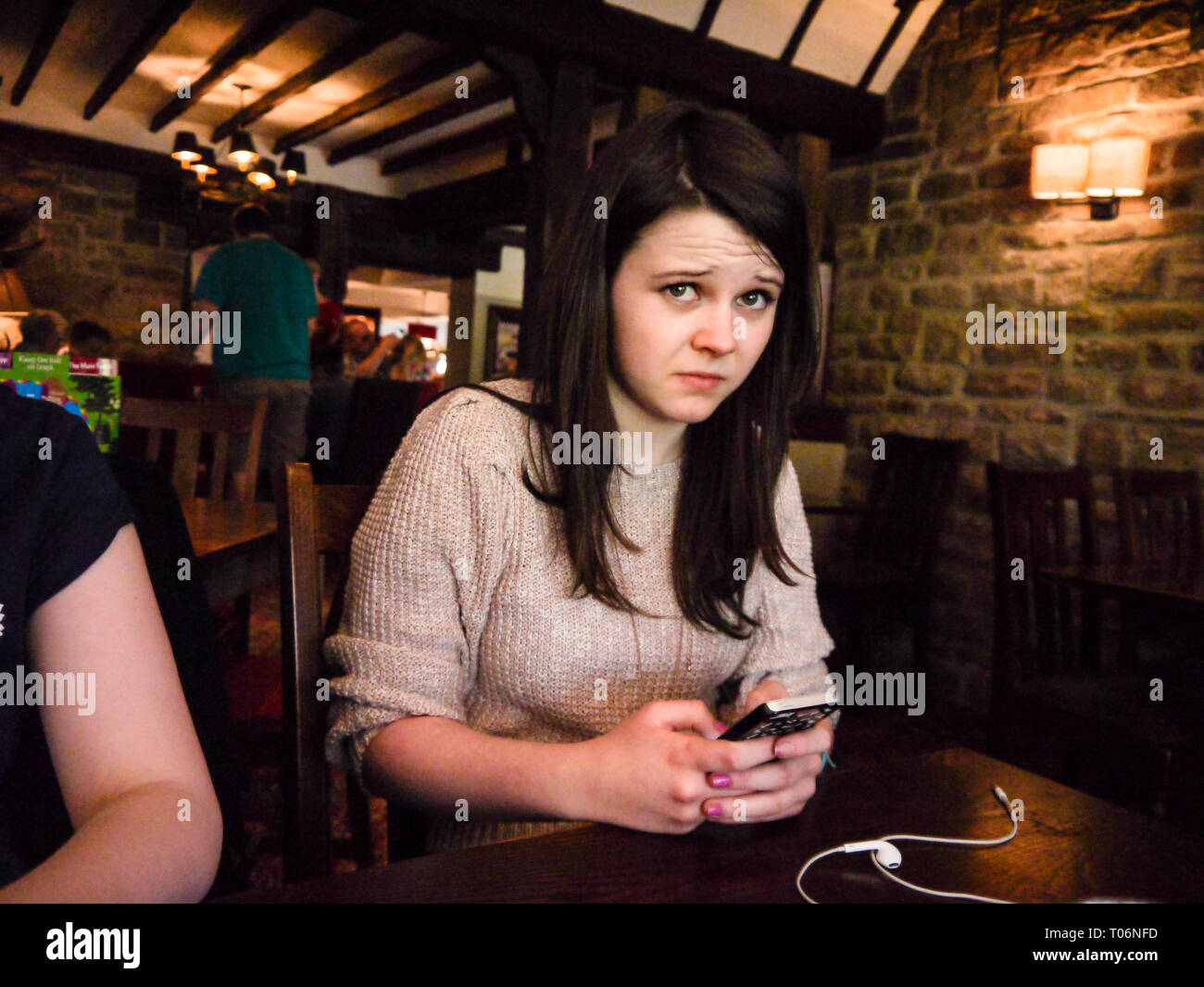 Millennial / Teenage girl in a pub Stock Photo - Alamy