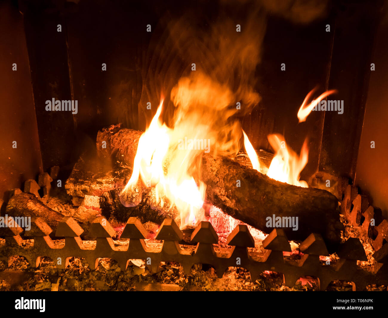 Coals burn and smolder in the furnace with orange flame Stock Photo - Alamy