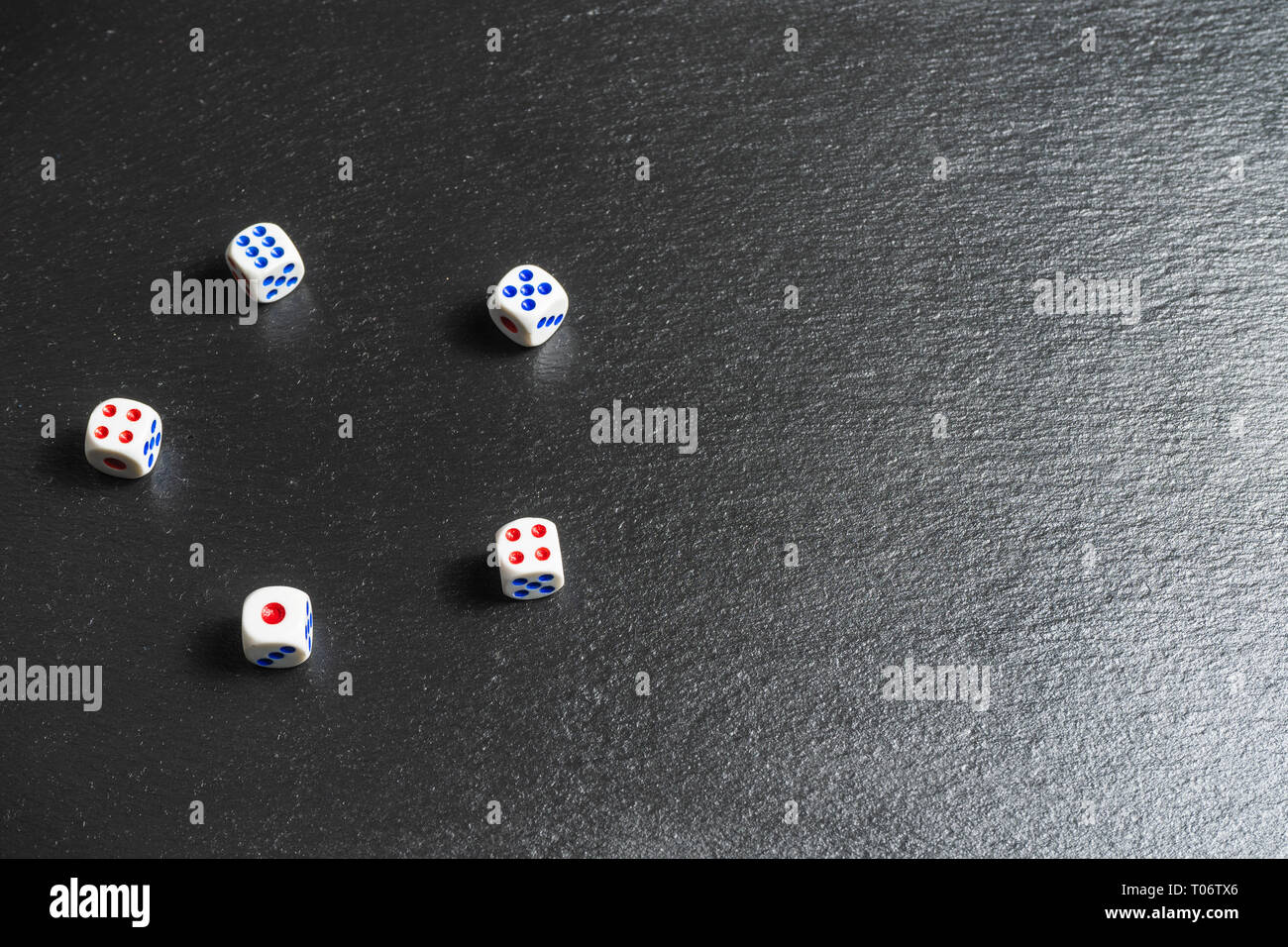 Life is a game concept.Dice on black background,gambling addiction ...