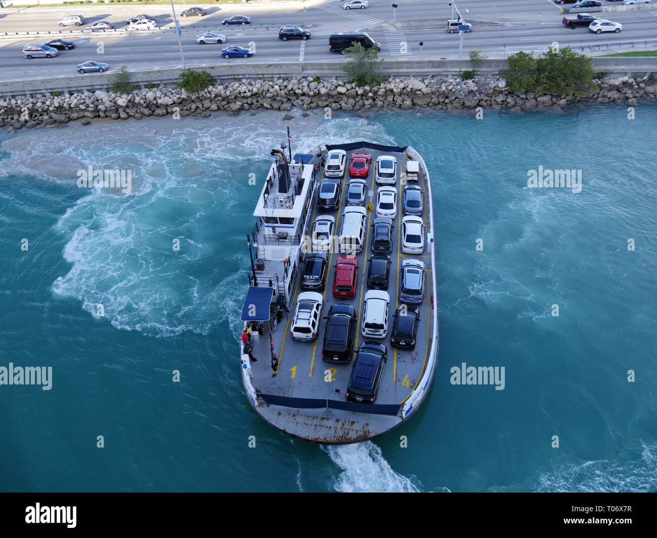 MIAMI, FLORIDA, USA—JANUARY 2018: A ferry carries a fleet of cars ...