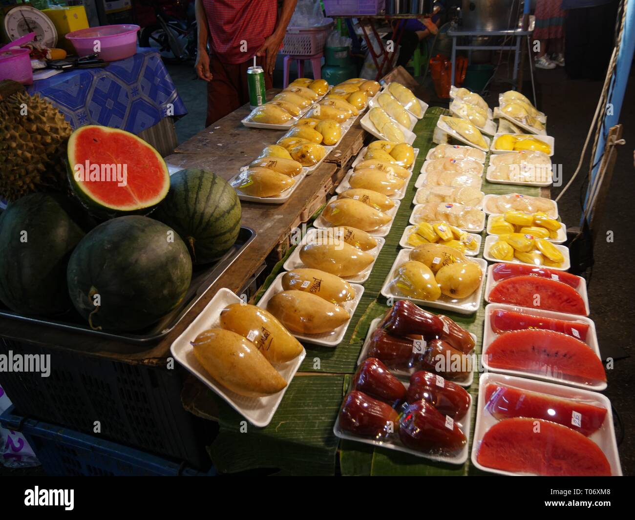 CHIANG MAI, THAILAND—MARCH 2018: Rows of ripe fruit displayed at a side ...
