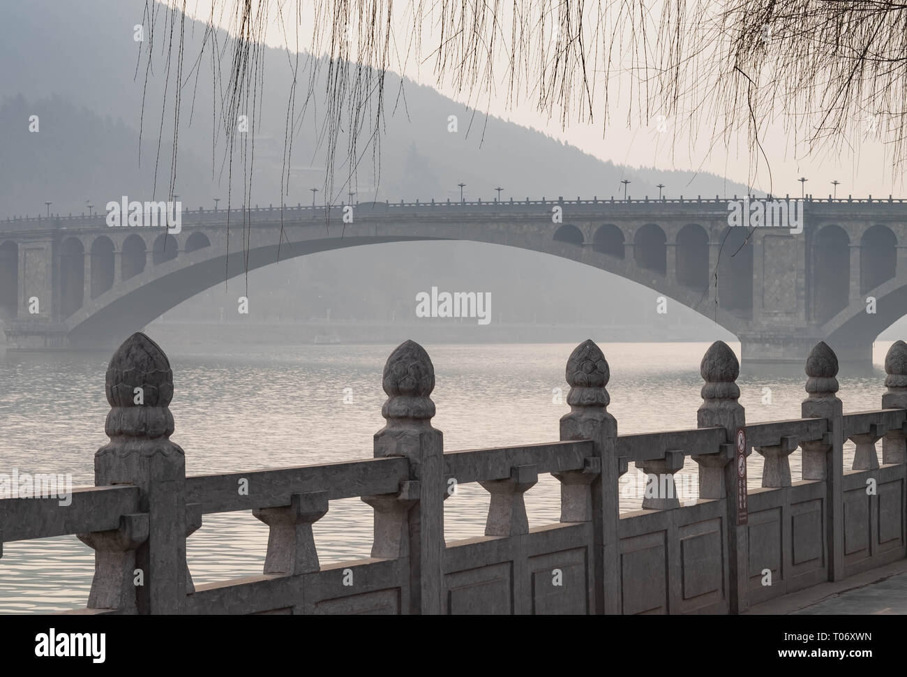 The walk way along and the bridge with the Chinese style at the Longmen ...