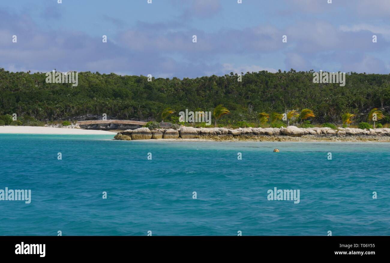 Idyllic tropical island covered with lush forests at the Exuma Cays, a ...