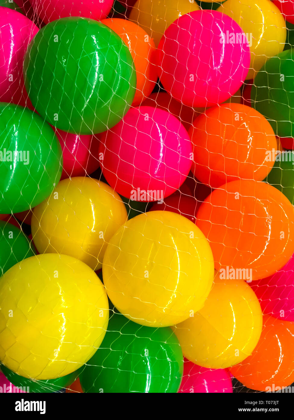Balls colored packaging in grid. Studio Photo Stock Photo - Alamy