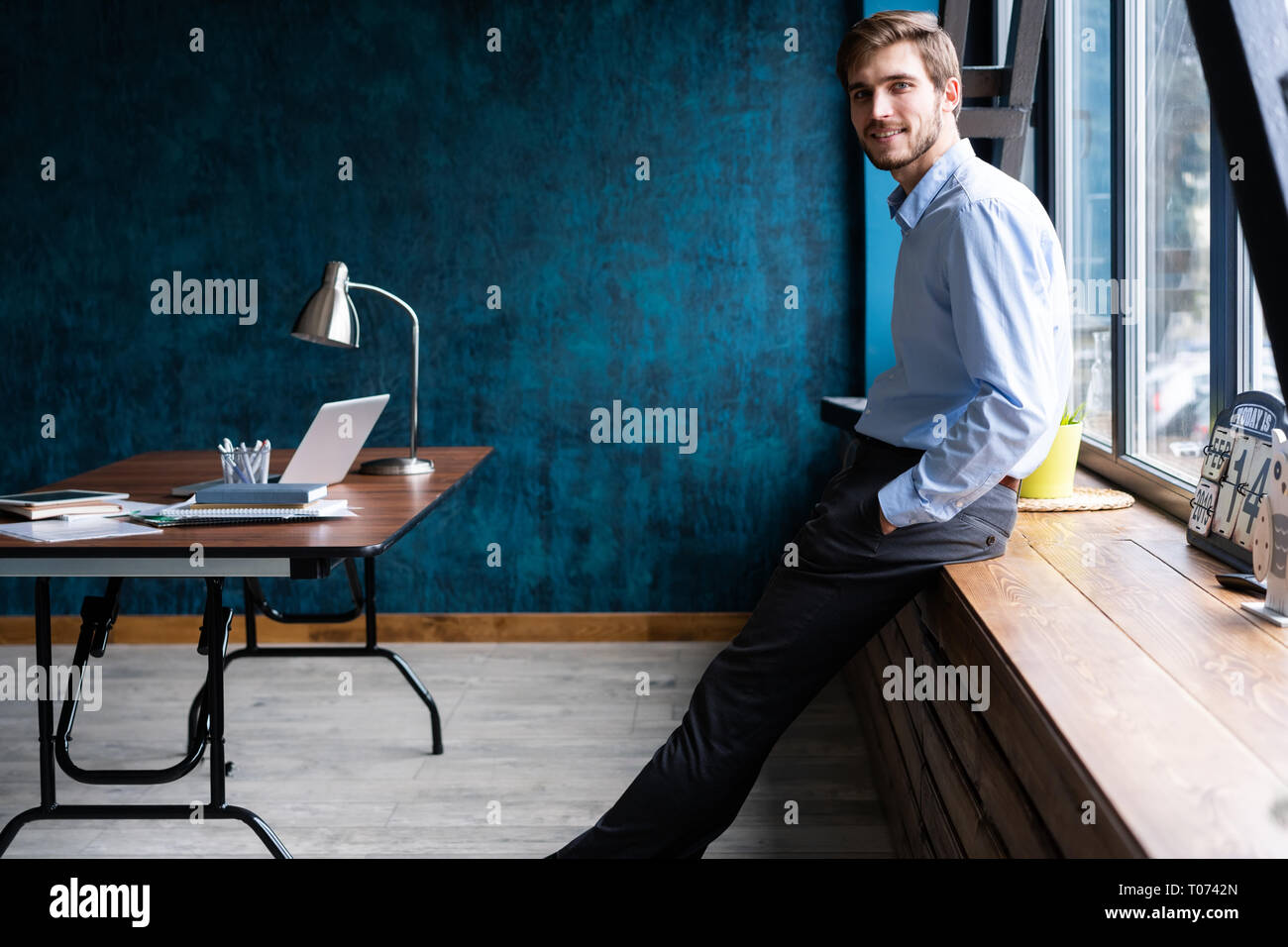 Man stands standing desk modern office hi-res stock photography and ...