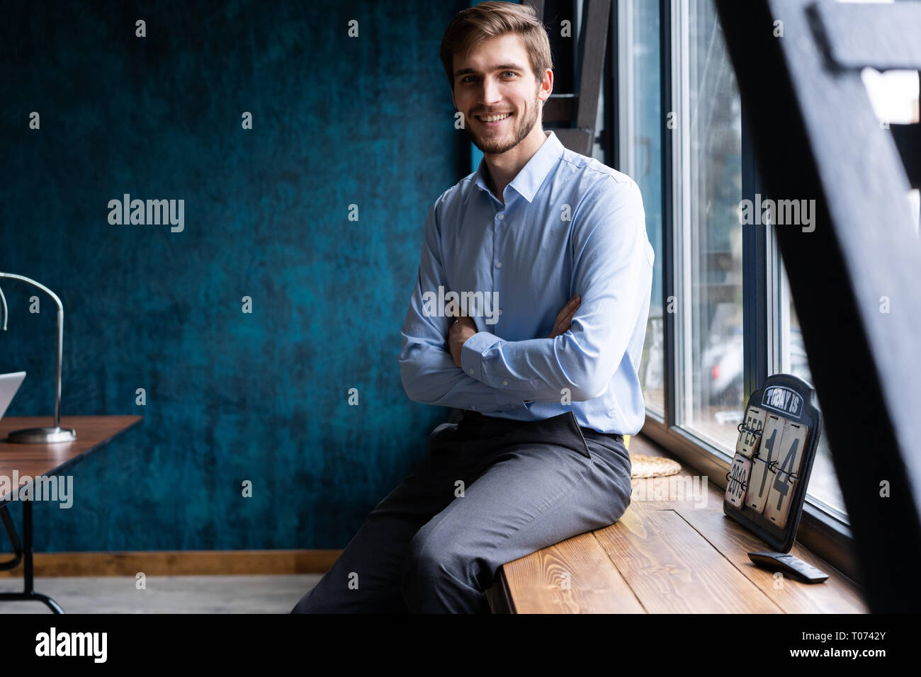 Businessman wearing modern suit and stands in contemporary office Stock ...
