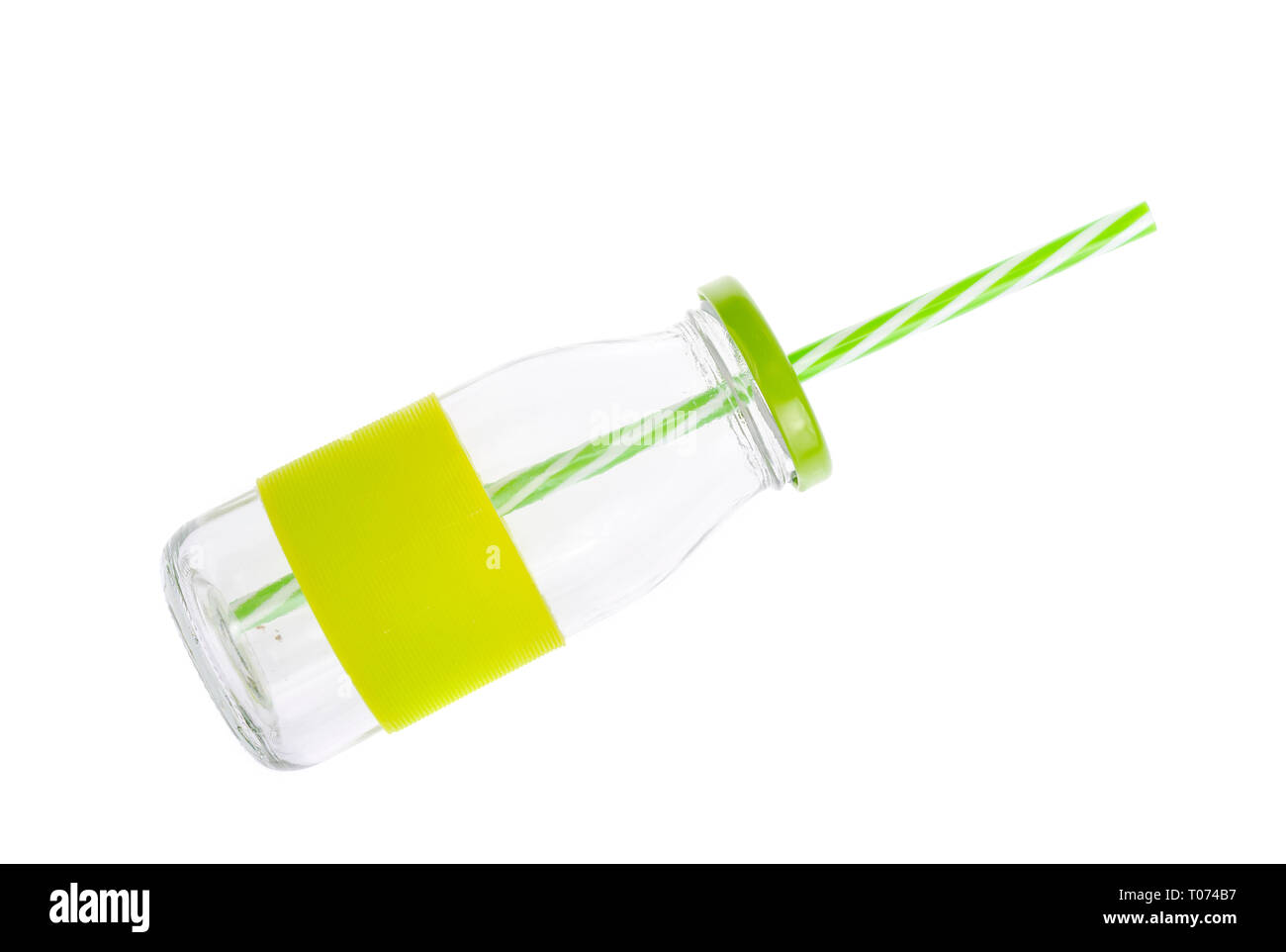 Glass bottle with green cap and drinking tube. Studio Photo Stock Photo ...
