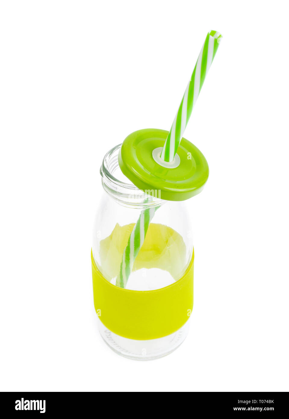 Glass bottle with green cap and drinking tube. Studio Photo Stock Photo ...