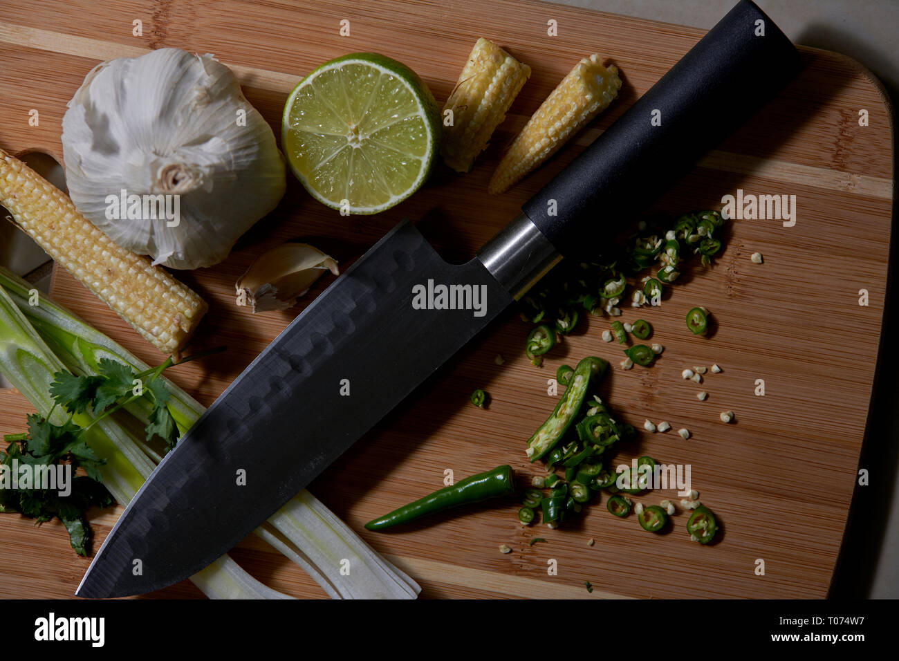 Asian Thai chillis and Vegetables for ingredients on chopping board ...