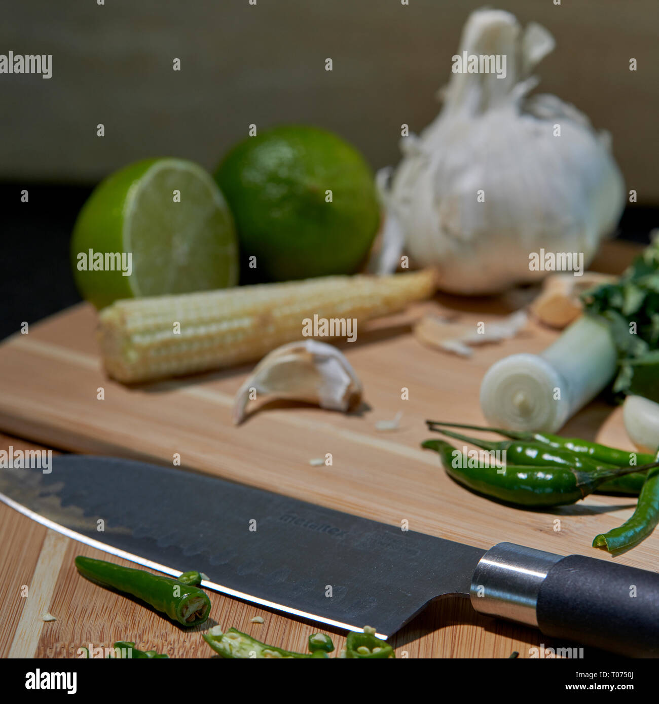Asian Thai chillis and Vegetables for ingredients on chopping board ...