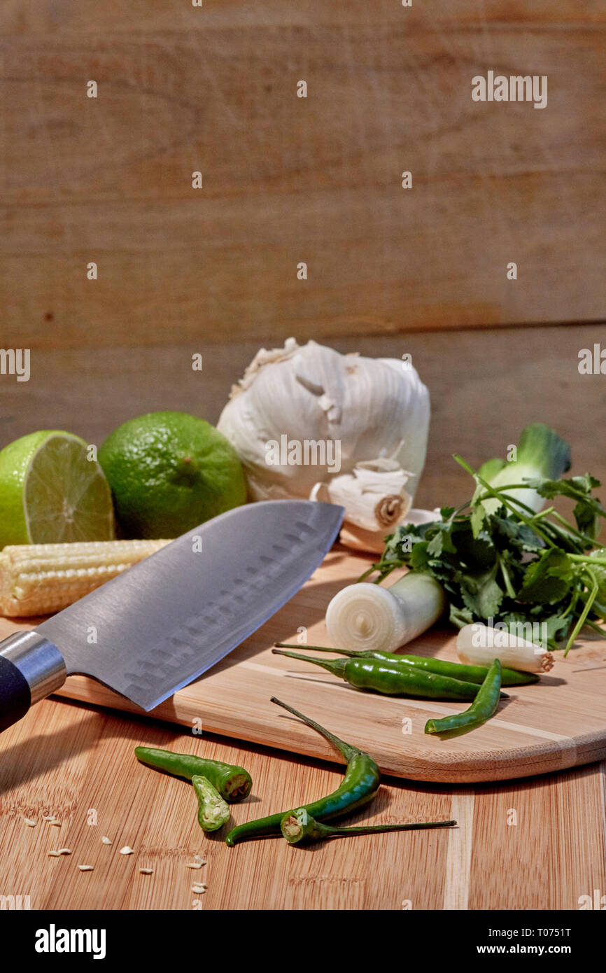 Asian Thai chillis and Vegetables for ingredients on chopping board ...
