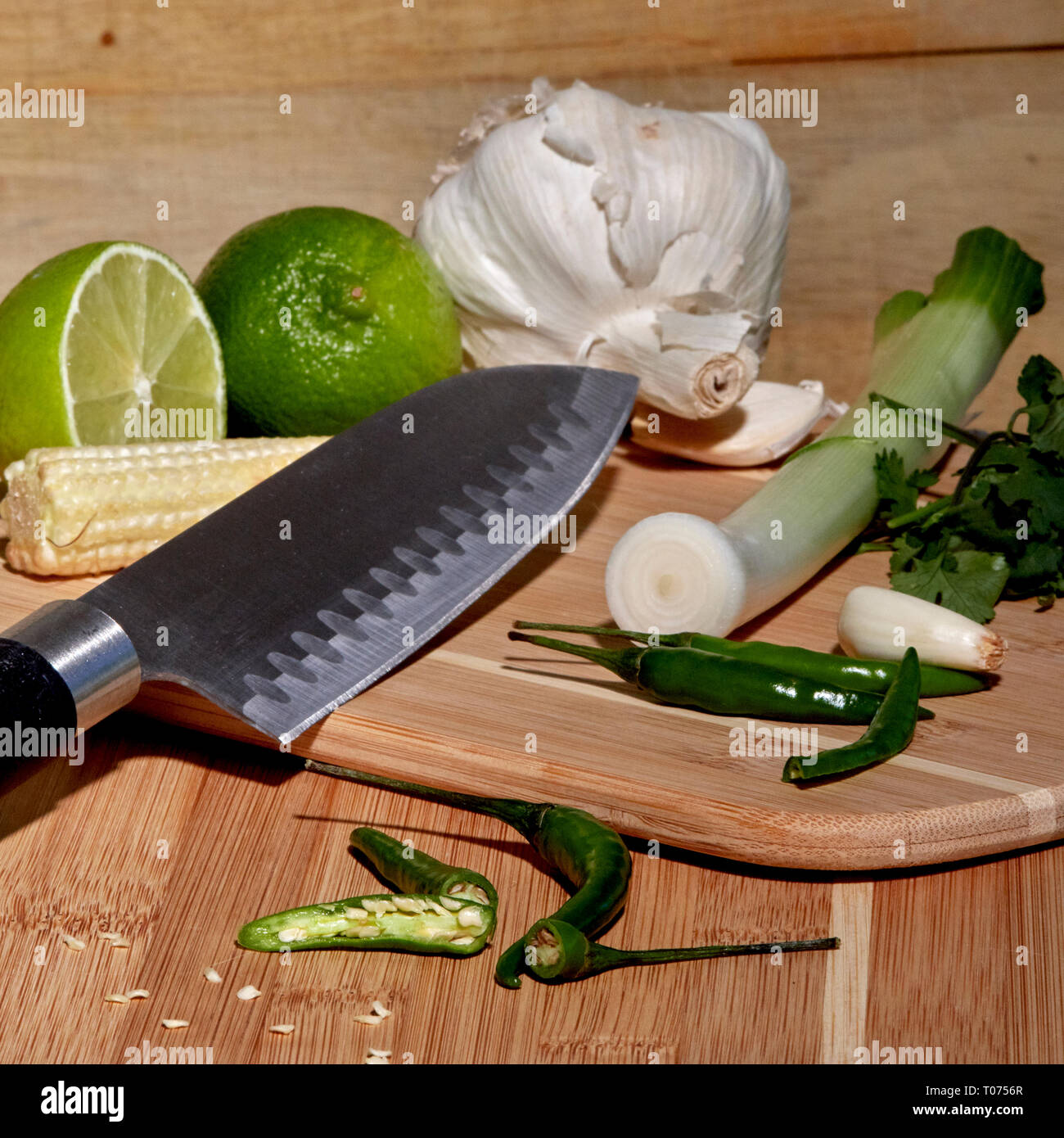 Asian Thai chillis and Vegetables for ingredients on chopping board ...