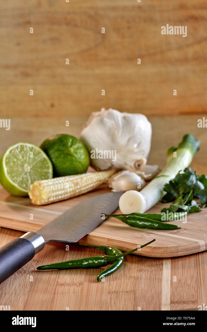 Asian Thai chillis and Vegetables for ingredients on chopping board ...