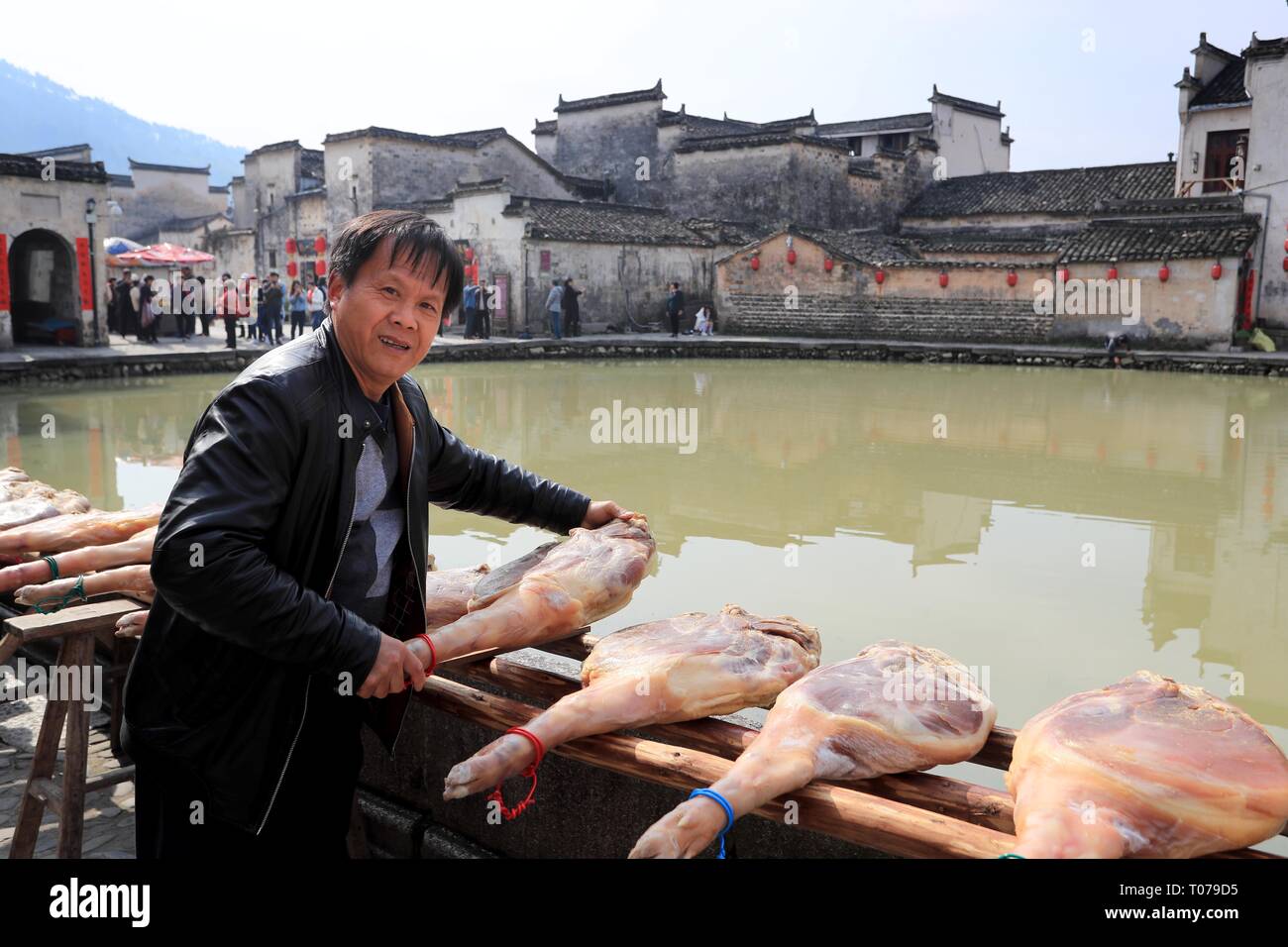 Huangshan, Huangshan, China. 18th Mar, 2019. Huangshan, CHINA-People air dry-cured ham in ...