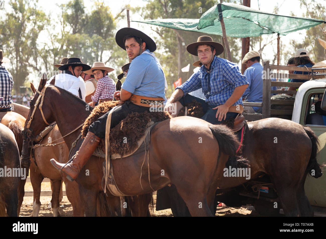 Local spectators watch the Rodeo riding their horses during the "Patria ...