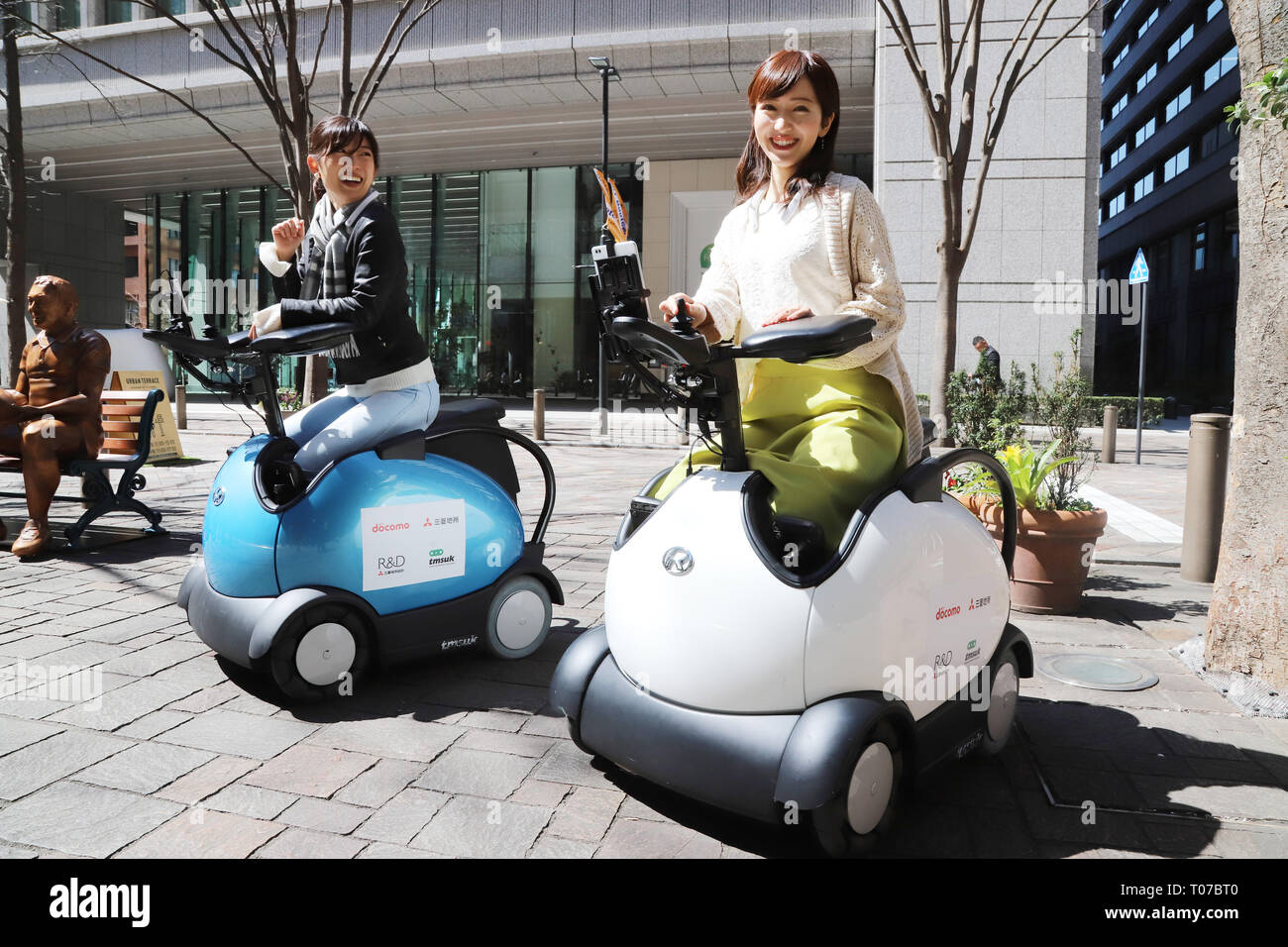 Tokyo, Japan. 18th Mar, 2019. Models demonstrate Japanese robot company ...
