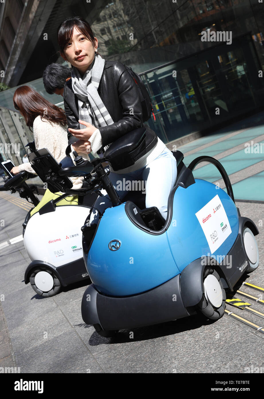 Tokyo, Japan. 18th Mar, 2019. Models demonstrate Japanese robot company ...