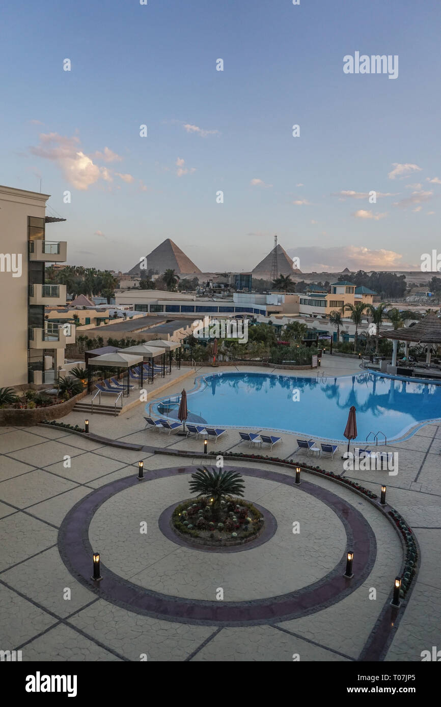 Giza, Egypt: View of the Khufu pyramid complex from the courtyard of a ...