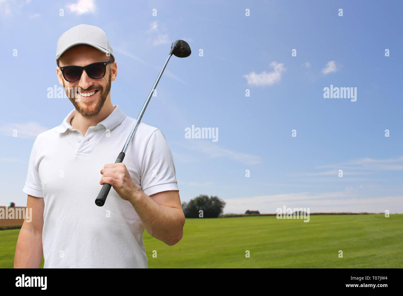 Portrait of male golfer with golf club at course Stock Photo - Alamy