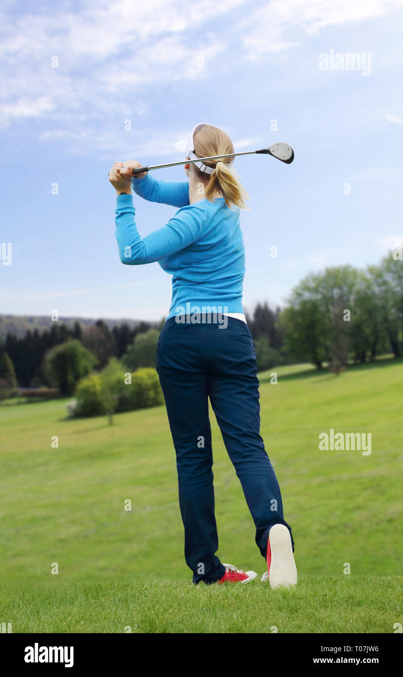 Caucasian female golfer hit a golf ball by golf-club driver Stock Photo ...