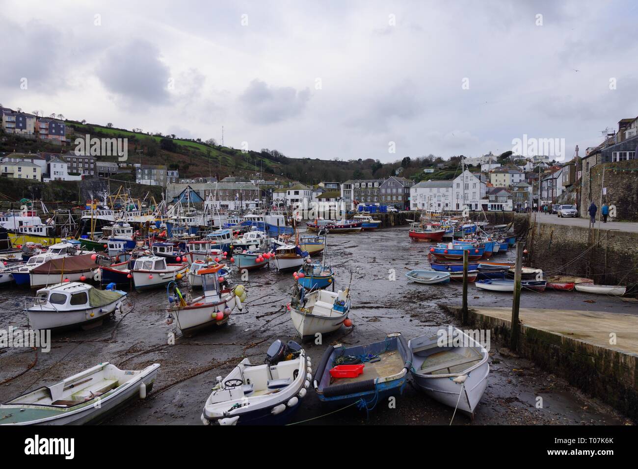 Fishing port low tide Stock Photo - Alamy