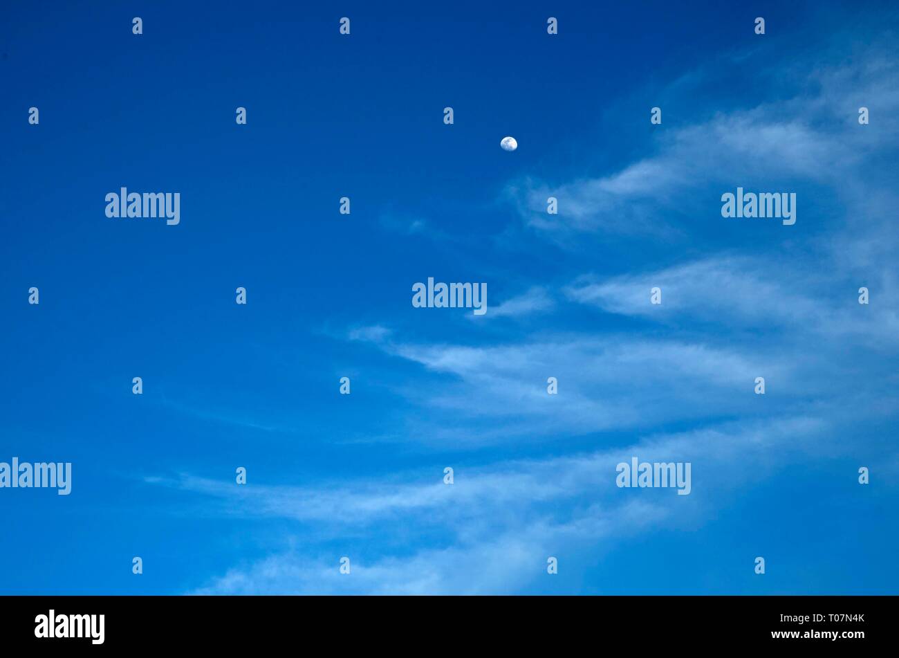 A waxing gibbous moon can be seen among cirrus clouds in California's ...