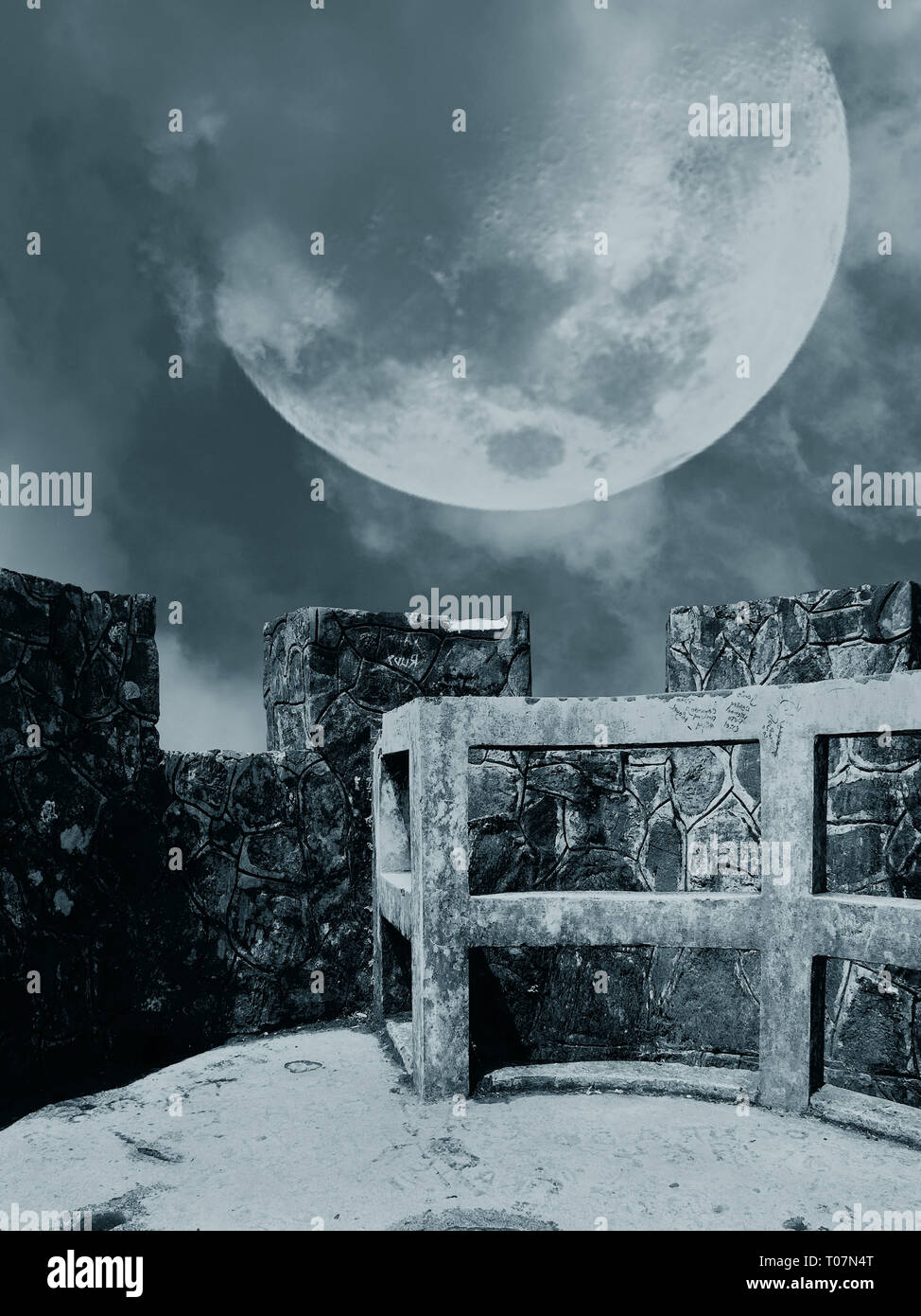 illustration of view of a huge moon on a castle with rock walls ...