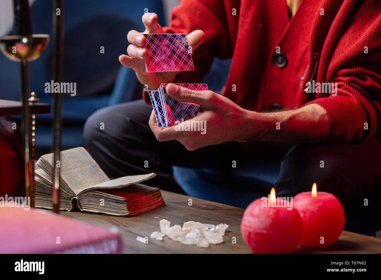 Close up of fortune-teller using oracle cards and little old book Stock ...