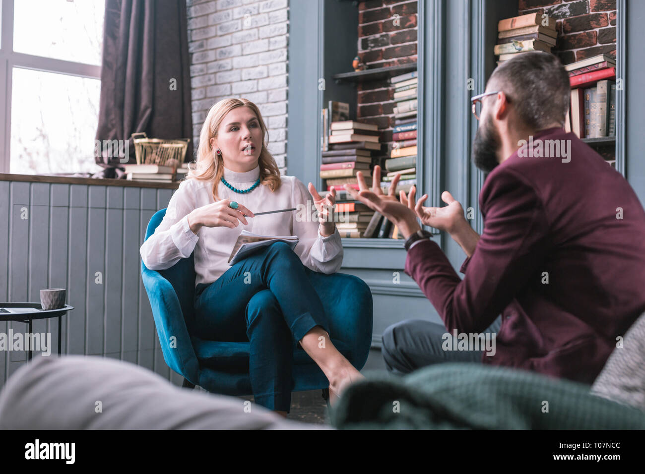 Professional smart private therapist talking to her constant client ...