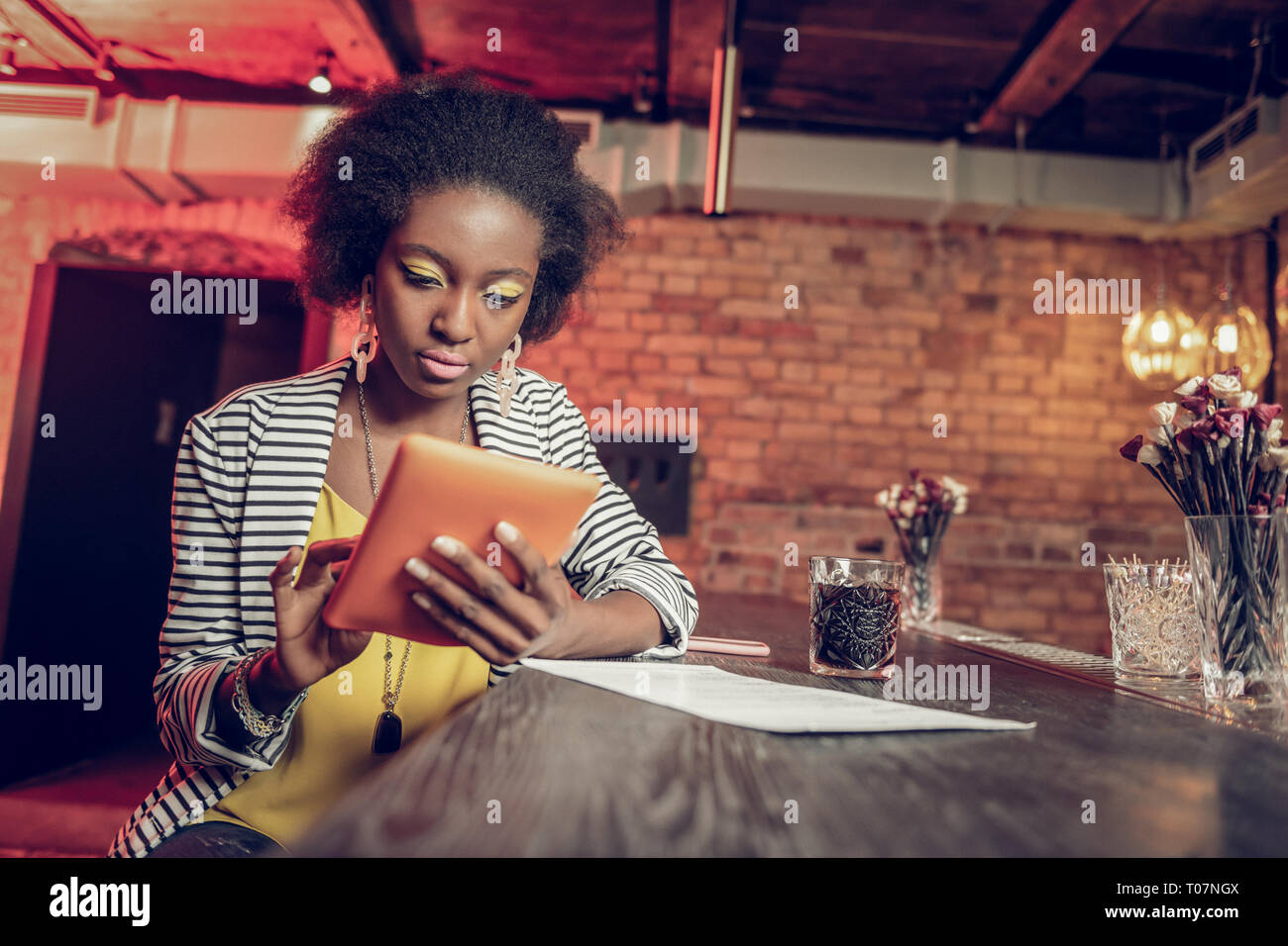 Young woman afro hair clicking hi-res stock photography and images - Alamy