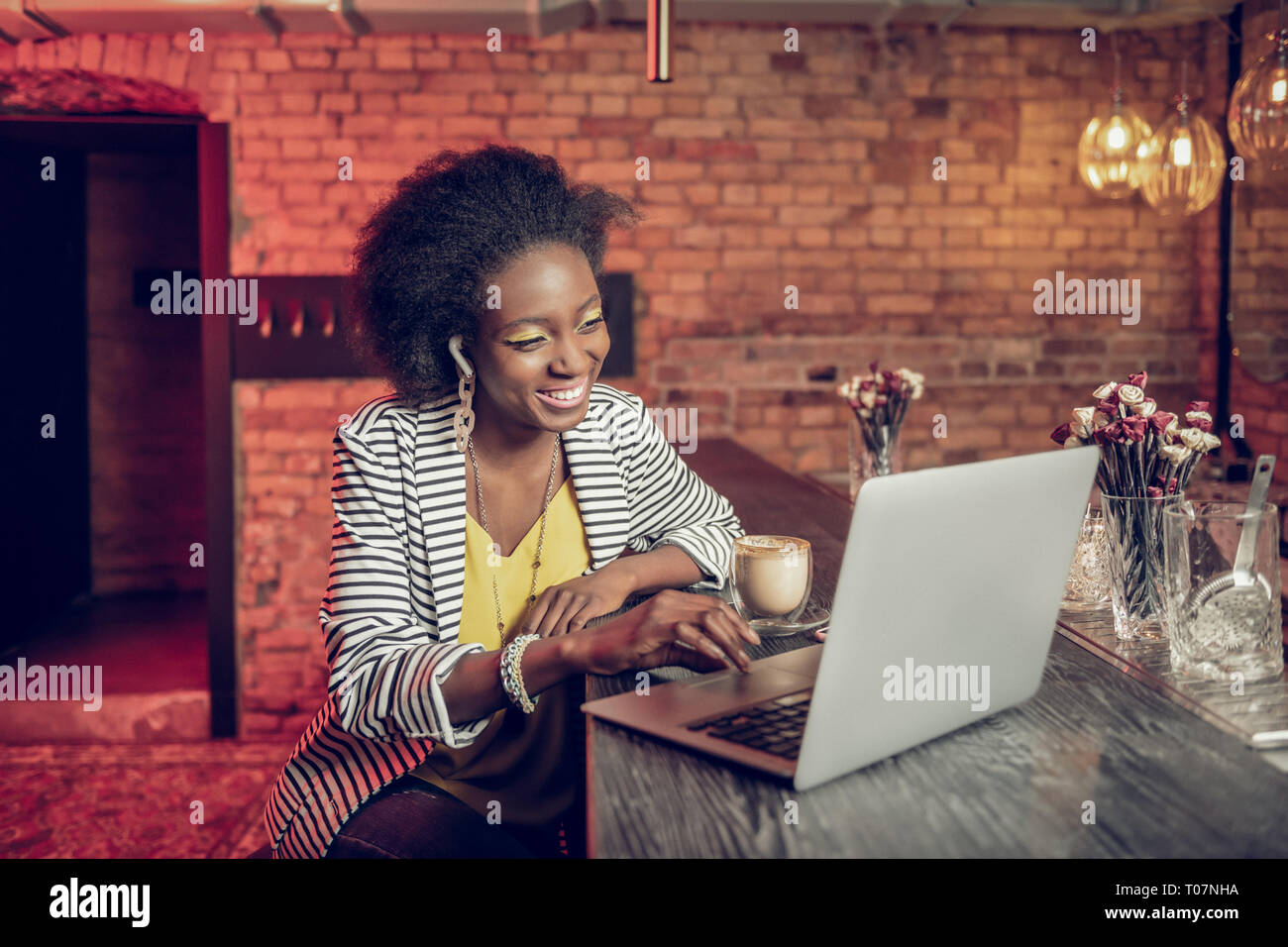 Young woman afro hair clicking hi-res stock photography and images - Alamy