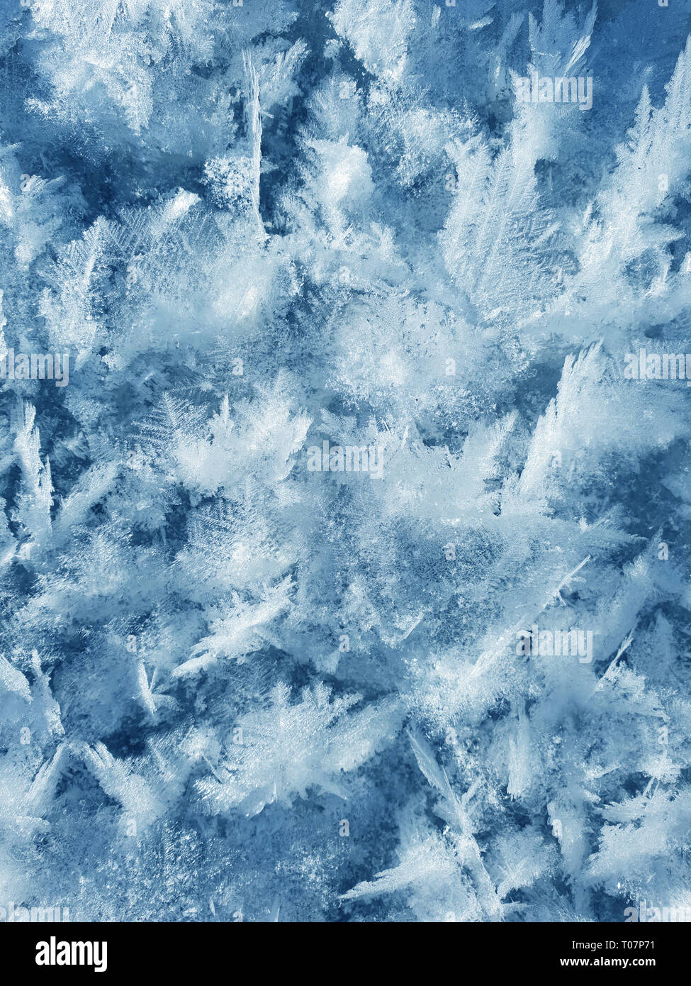 Snow crystals form beautiful snow pattern on frozen icy river ...