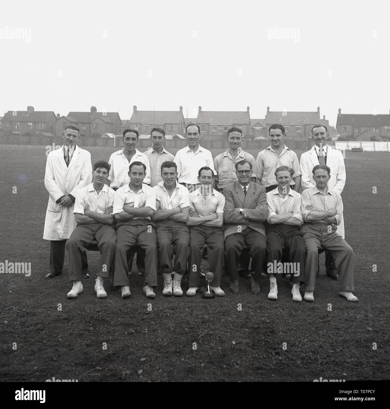 1950s, group photo for a works cricket team with trophy, England, UK ...