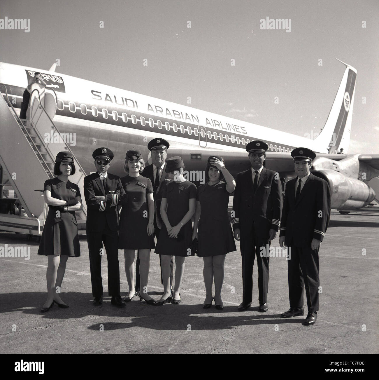 1960s, Saudian Arabian Airlines crew line-up outside their plane Stock ...