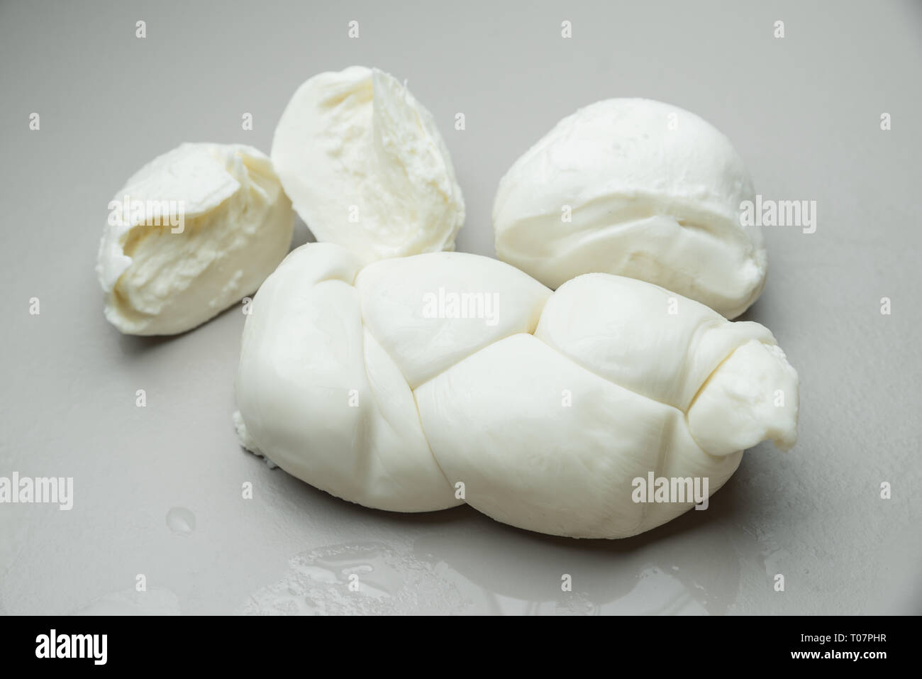 Traditional Italian mozzarella cheese on gray background Stock Photo ...