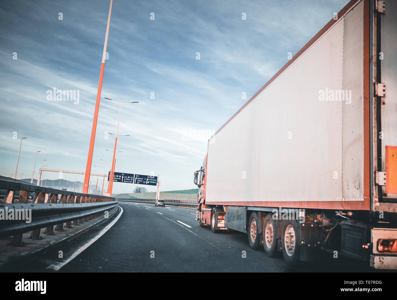 Truck with container on highway, cargo transportation concept in ...