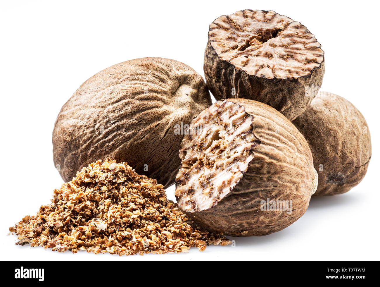 Dried seeds of fragrant nutmeg and grated nutmeg isolated on white ...