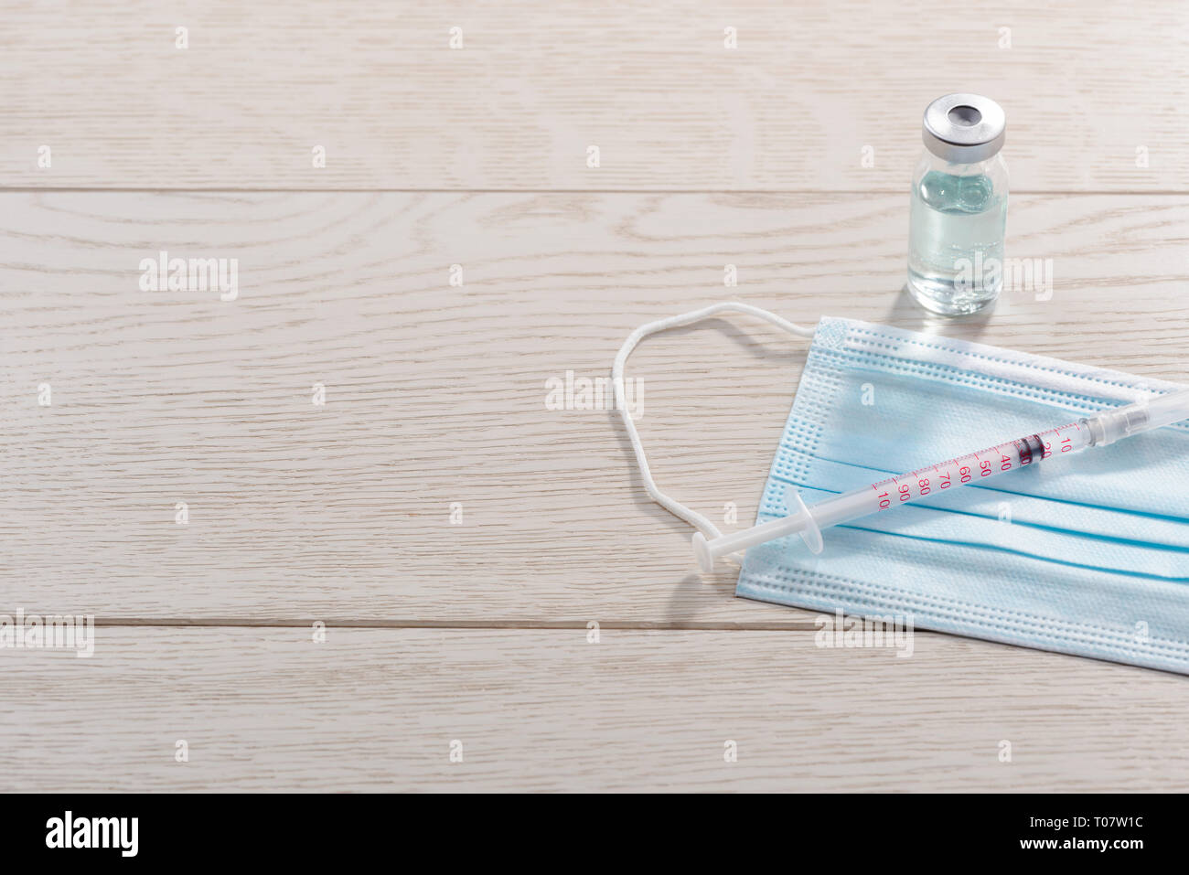 Face mask, medicine and syringe Stock Photo - Alamy