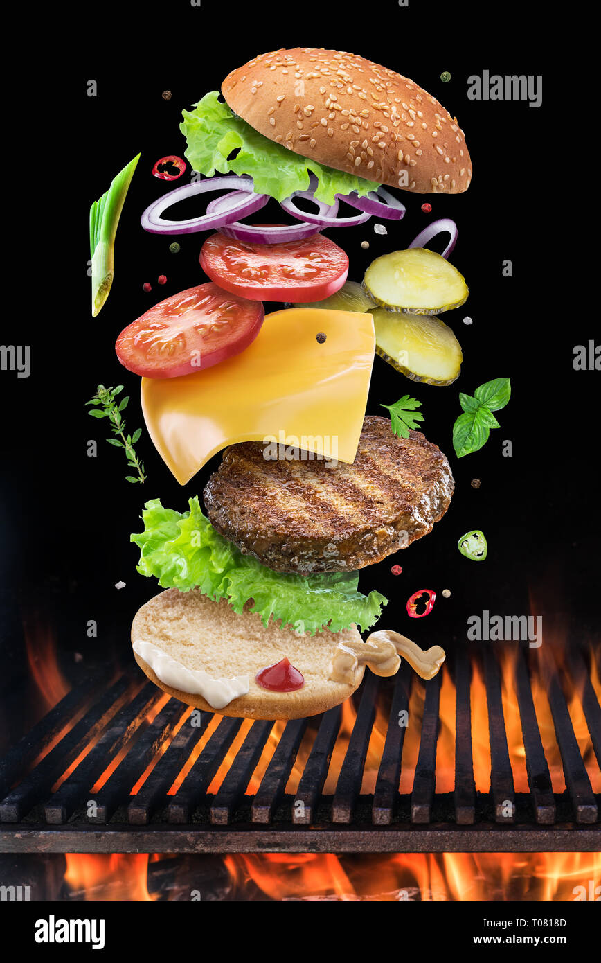 Hamburger ingredients falling down one by one to create a perfect meal ...