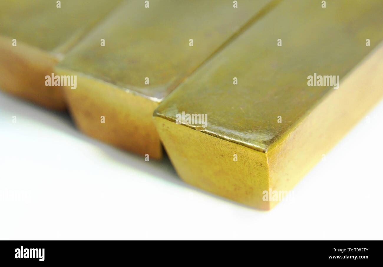 Three gold bars on white background Stock Photo - Alamy