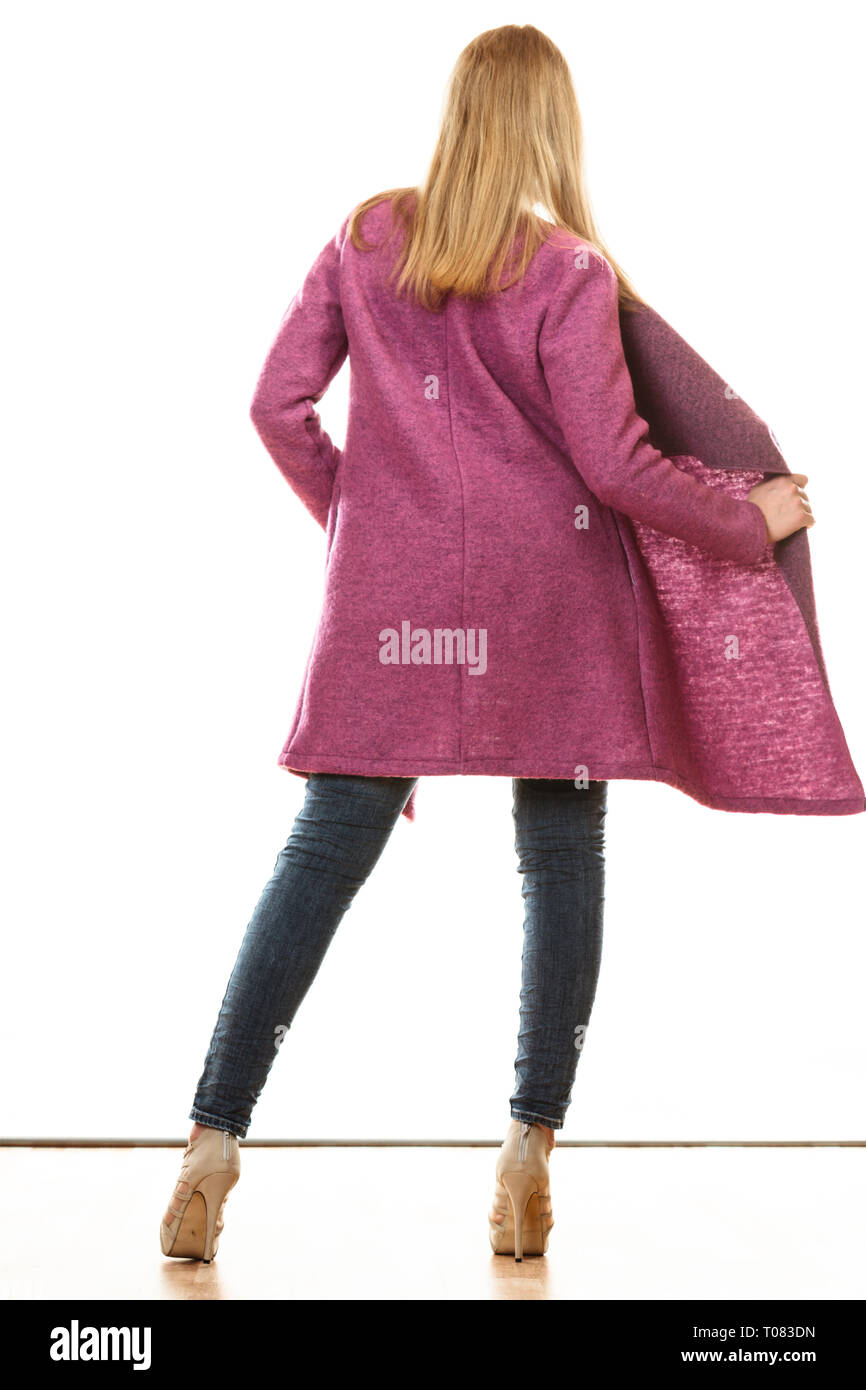 Fashion. Young blonde fashionable woman in vivid color pink coat ...