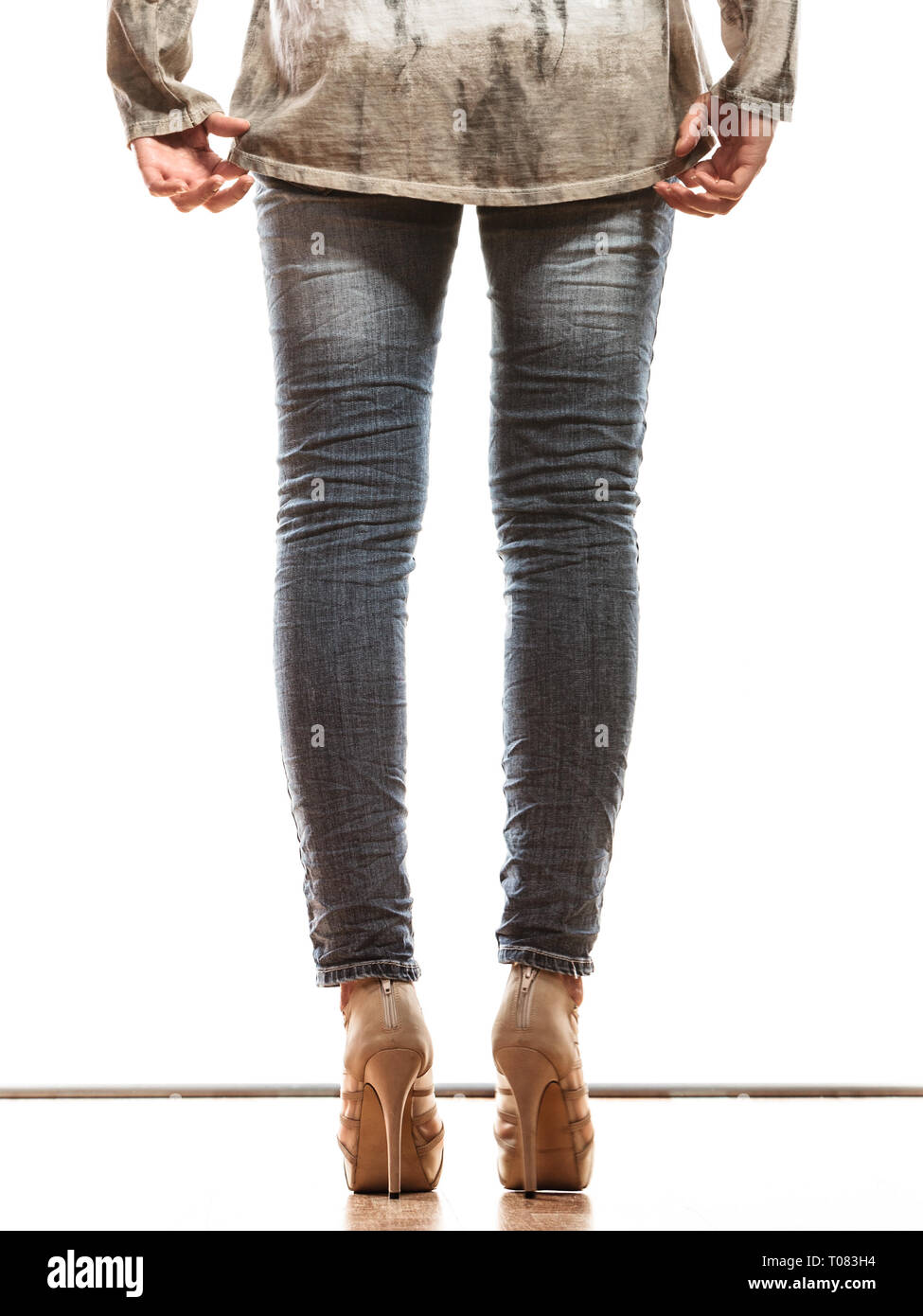 Fashion. Woman legs in denim trousers platform high heels shoes casual ...