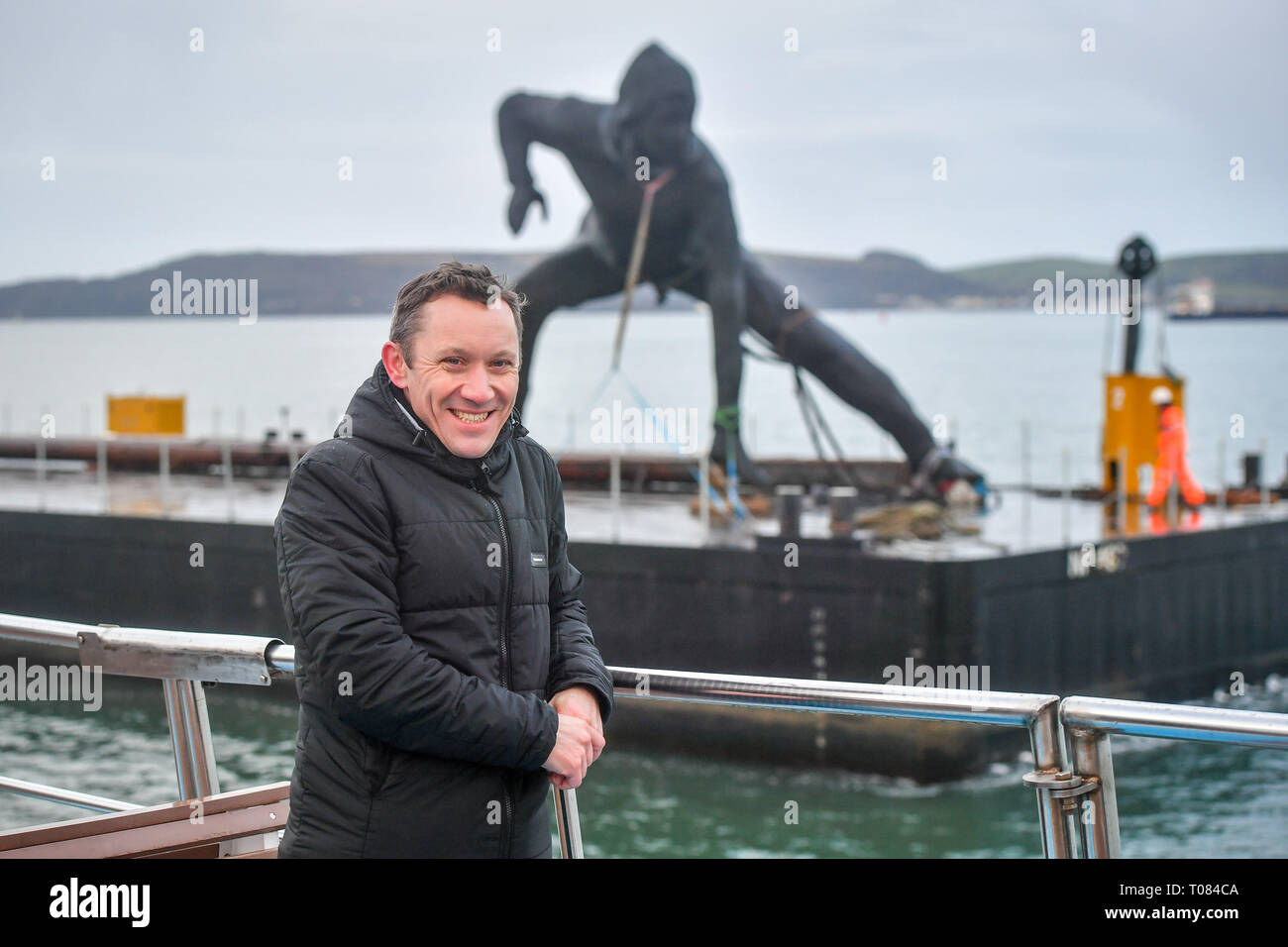 Artist Joseph Hillier on a boat beside his sculpture, Messenger, the ...